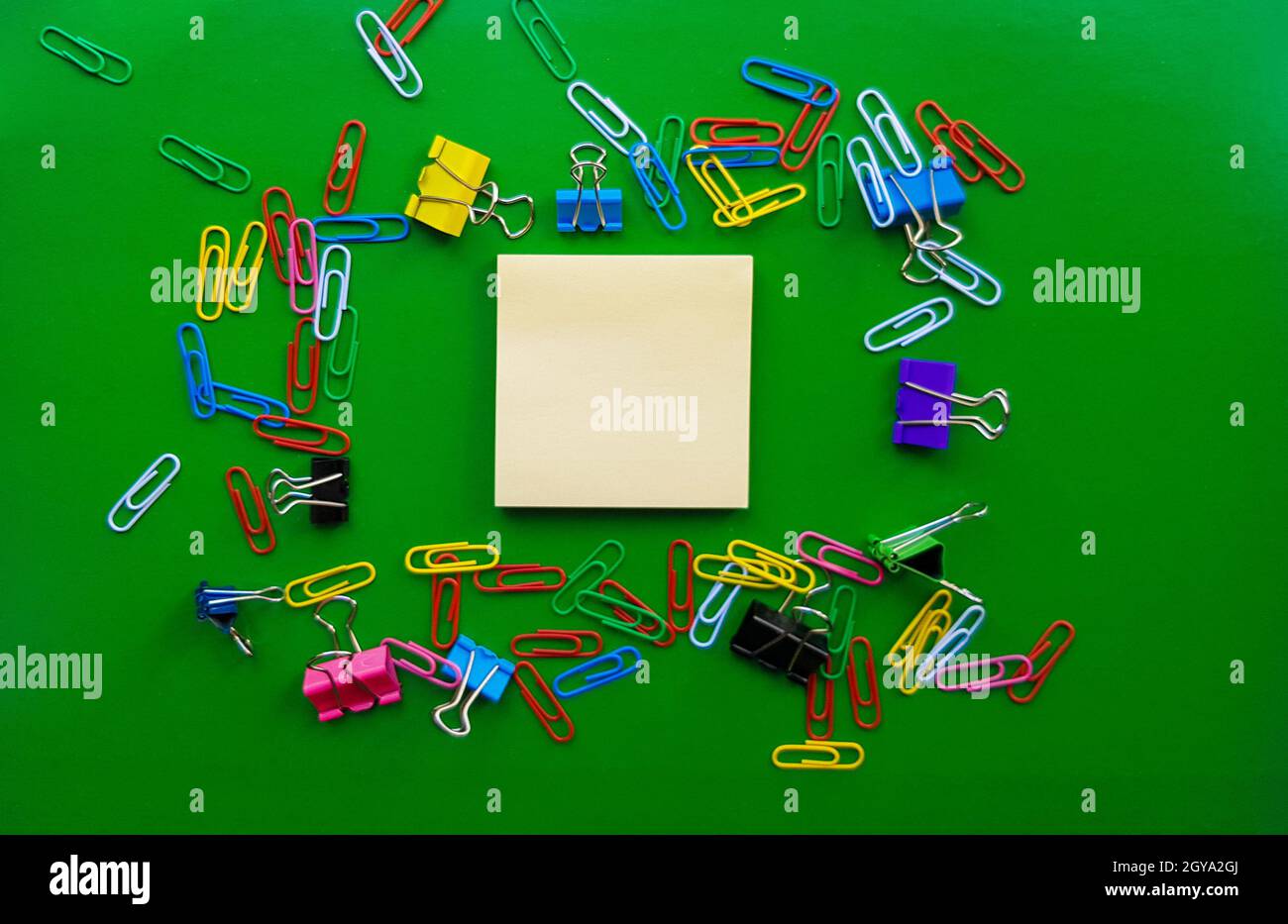 pile of paper clips isolated on green background, documents, office ...