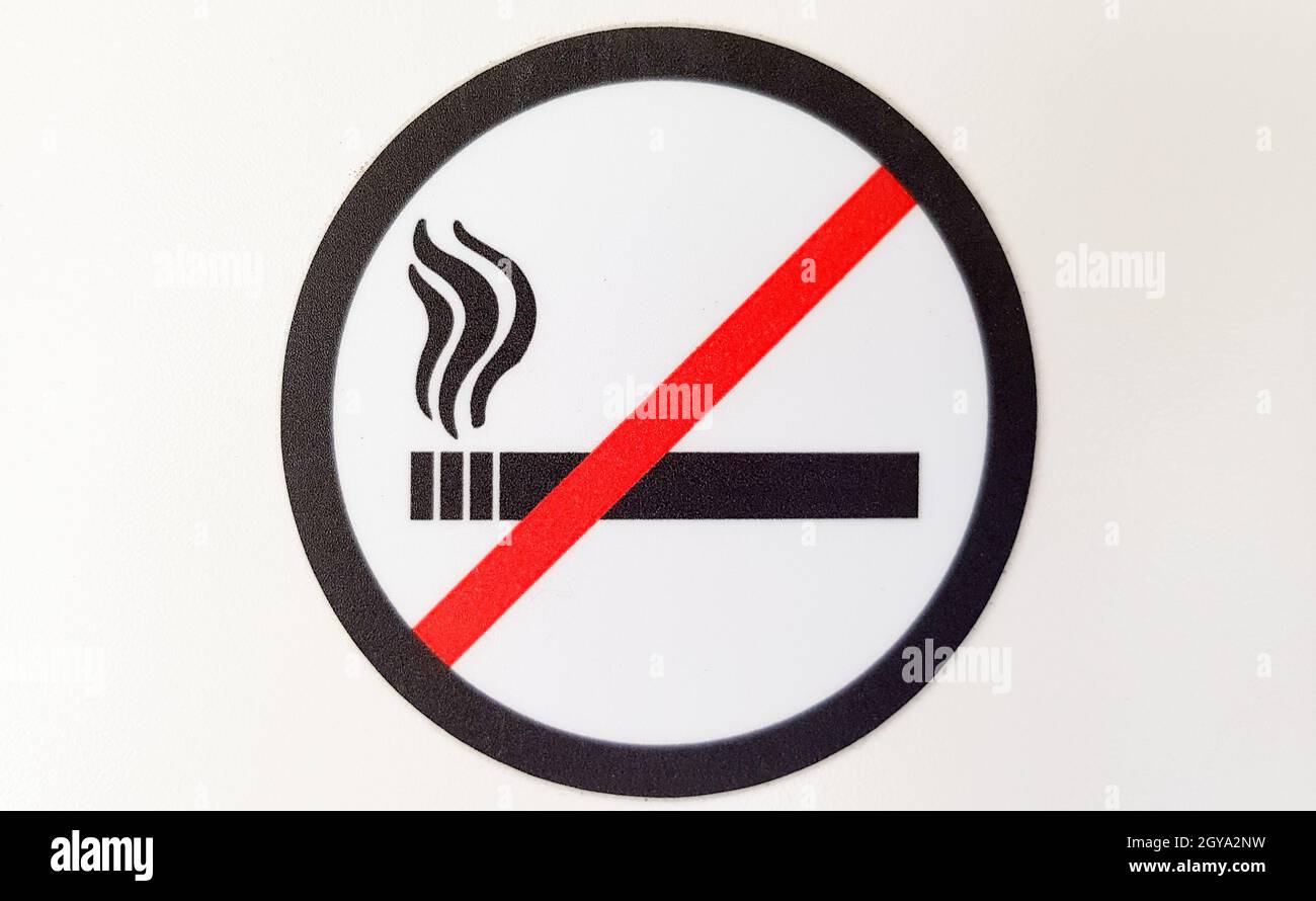 Round red and black no smoking sign, sticker in a public place on a ...