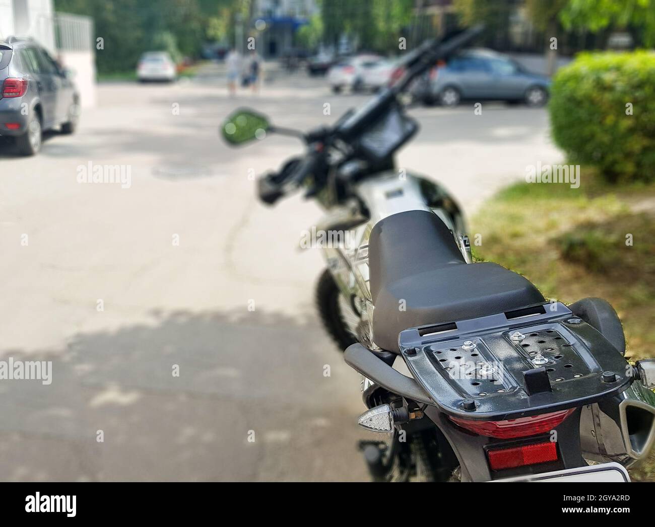 Black motorcycle parked. Back view. Soft focus Stock Photo - Alamy