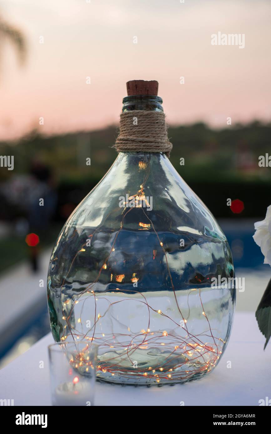 Decorative glass bottle by the swimming pool Stock Photo - Alamy