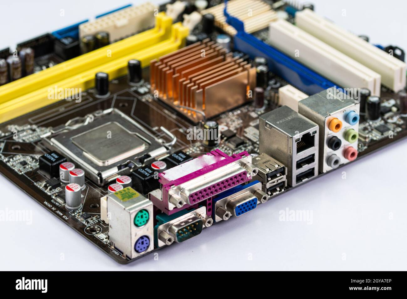 electronic motherboard of a pc disassembled on a white surface Stock ...