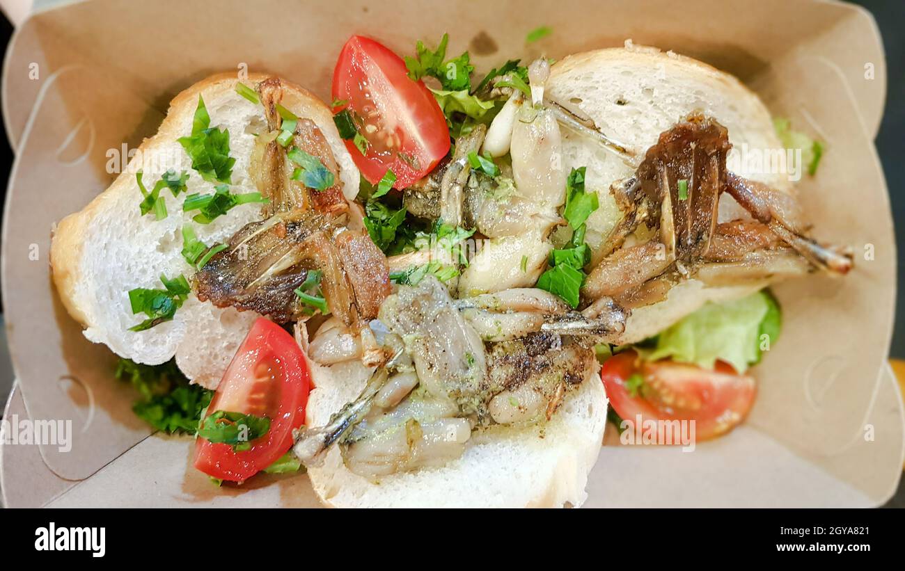 Cambodian dish grilled frog. Tasty exotic dishes are served in the ...