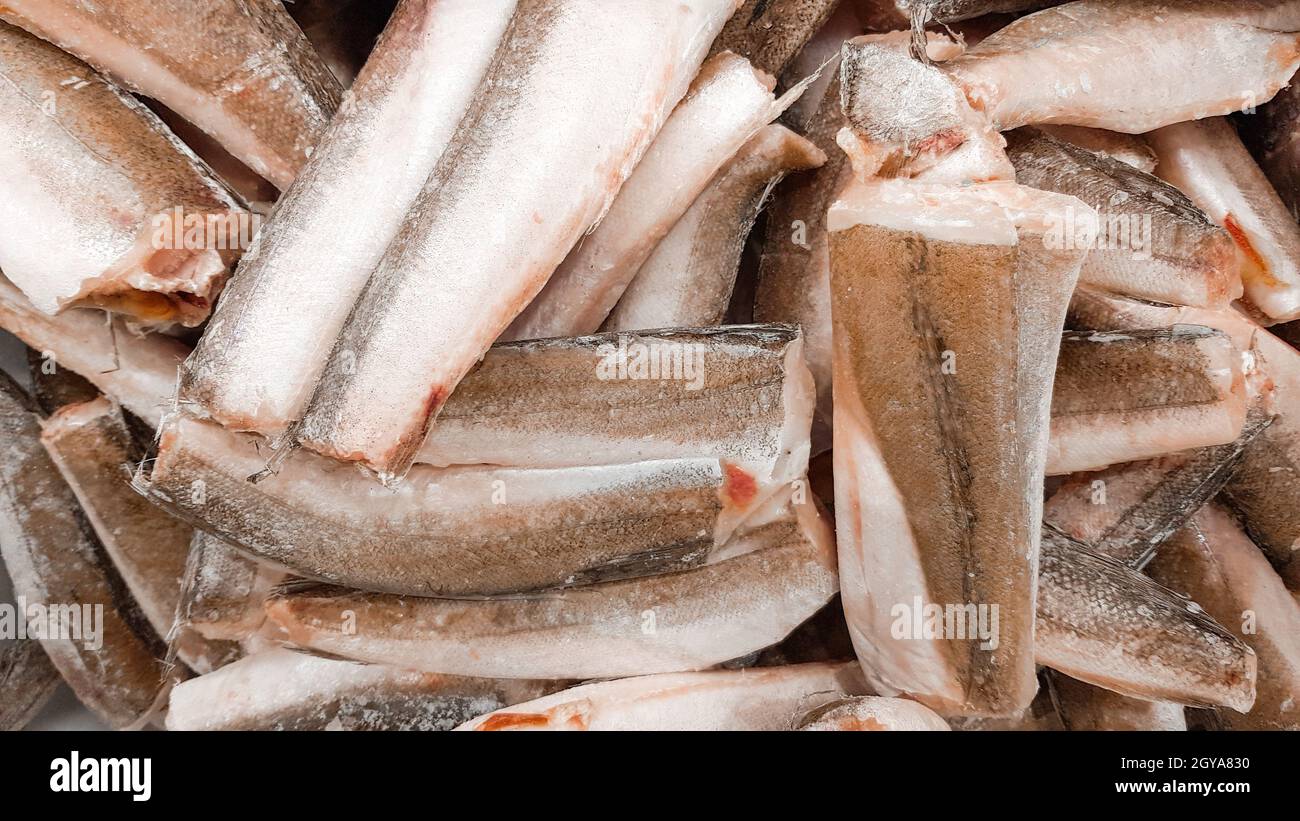Frozen hake fish close-up. Lots of fish on the counter Stock Photo - Alamy