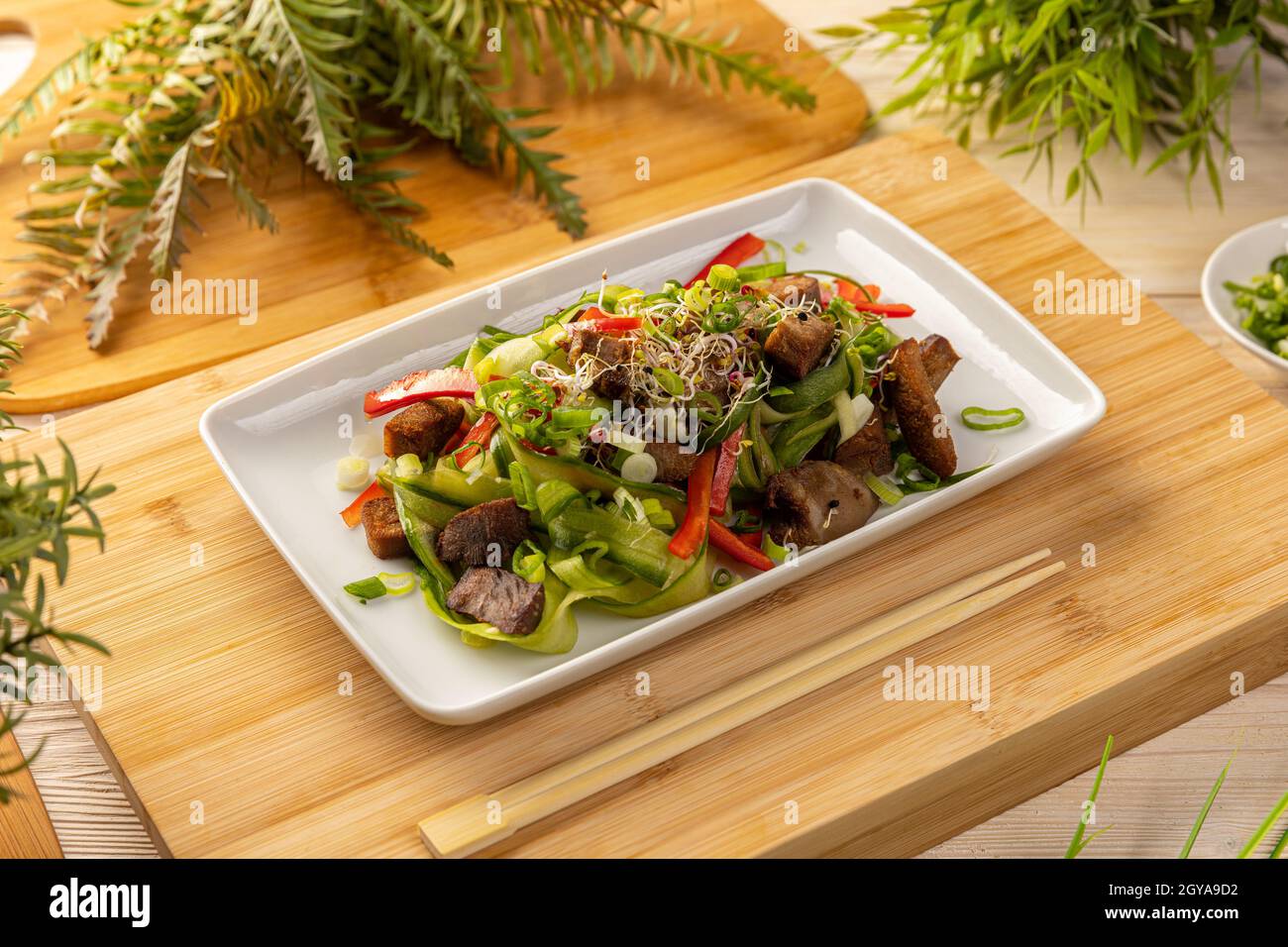 Asian style salad with beef cubes decorated with sprouts Stock Photo ...