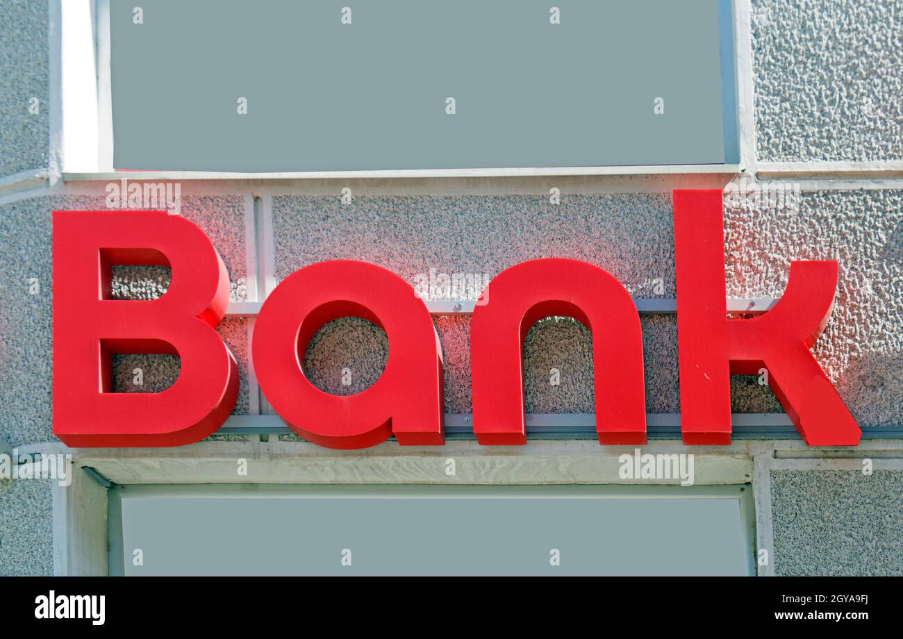 Bank signage attached to building facade in urban city Stock Photo - Alamy