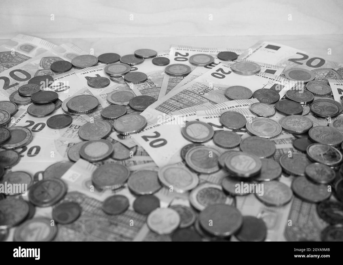 Euro banknotes and coins (EUR), currency of European Union in black and ...