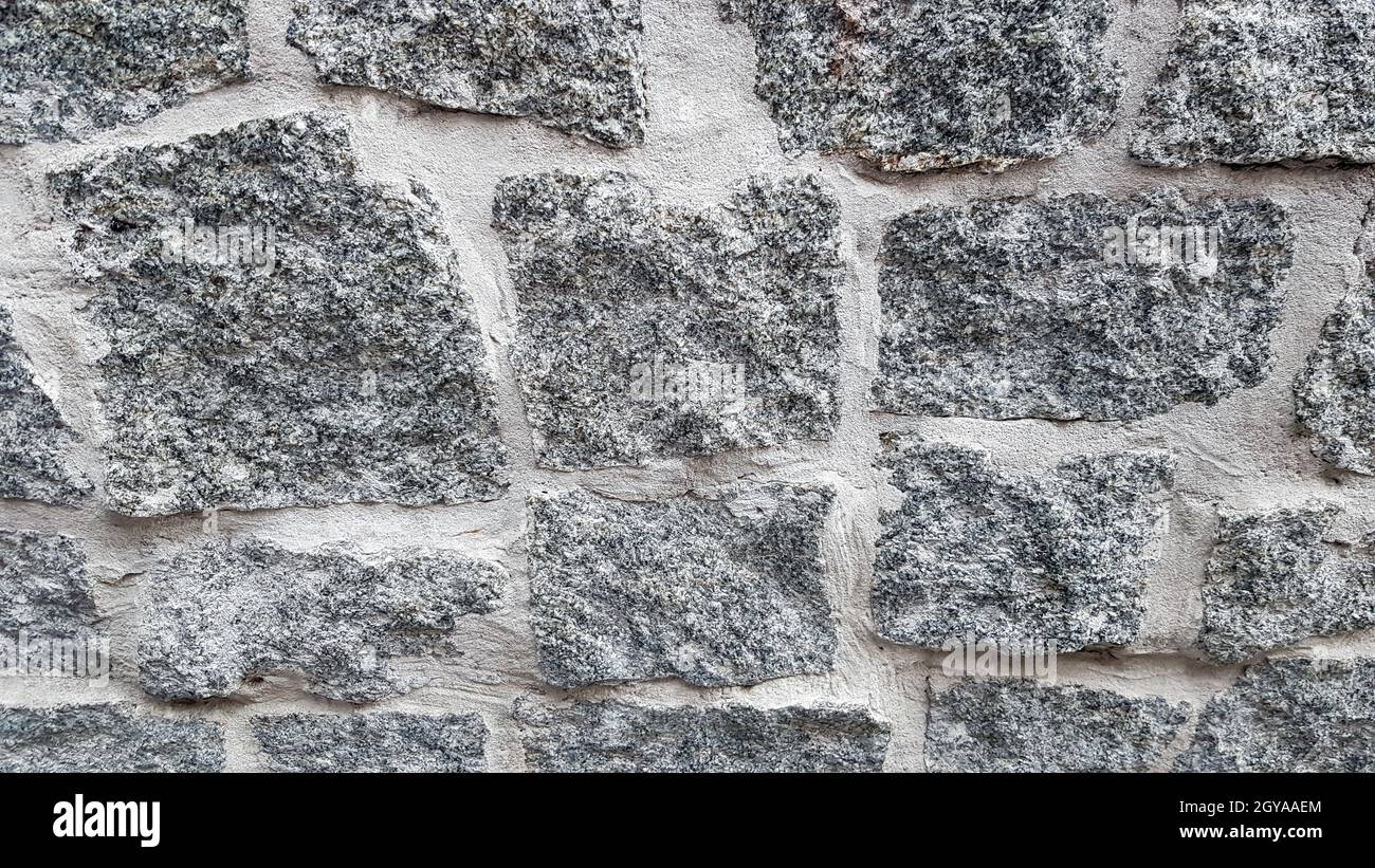 Gray stone wall background. The texture of the stone. Old castle wall ...