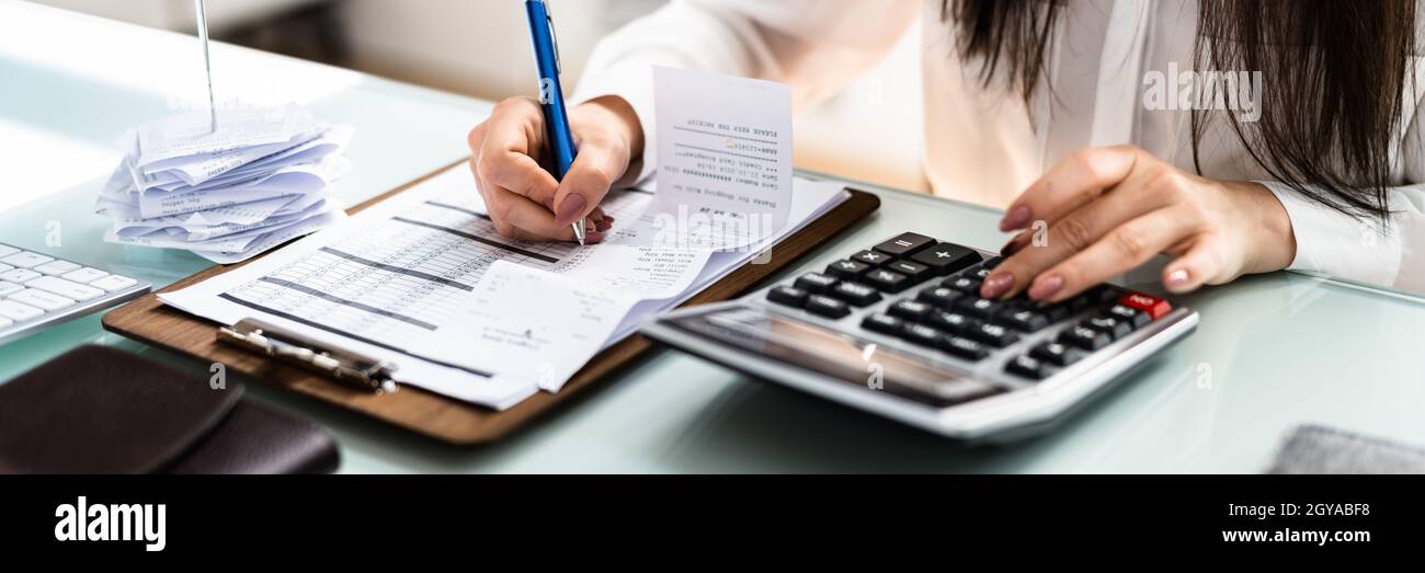 Accountant Doing Tax And Accounting Work Using Calculator Stock Photo ...