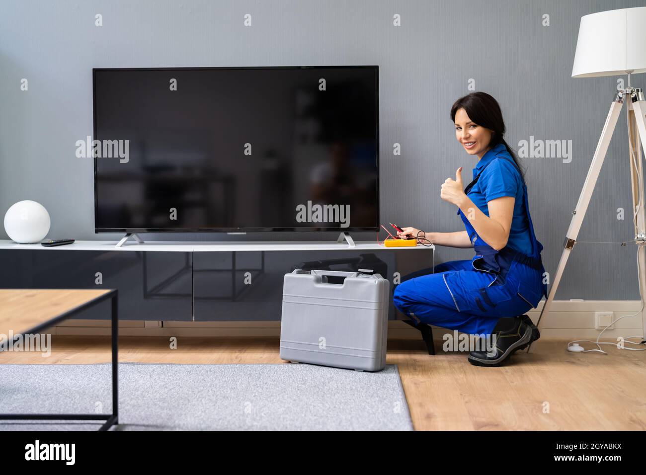 Electrician Repairing Television Or TV Appliance. Fixing Screen Stock ...