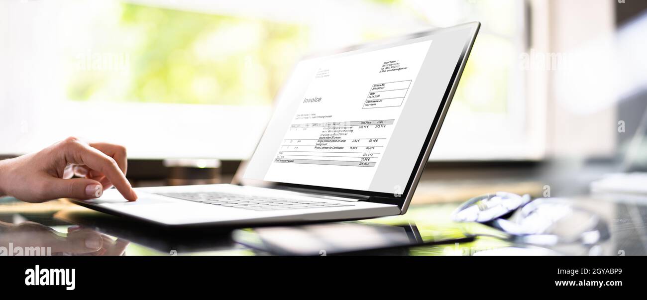 Accountant Calculating Electronic Invoice Or E Bill At Desk Stock Photo ...