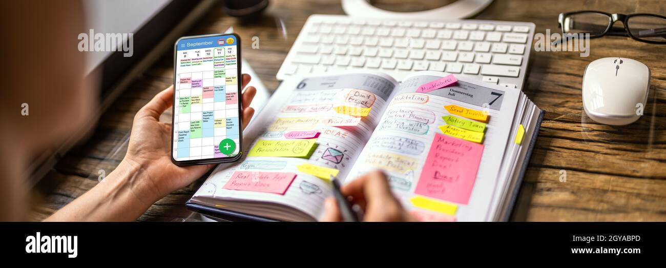 Calendar Schedule List At Desk And In Mobile Phone Stock Photo - Alamy