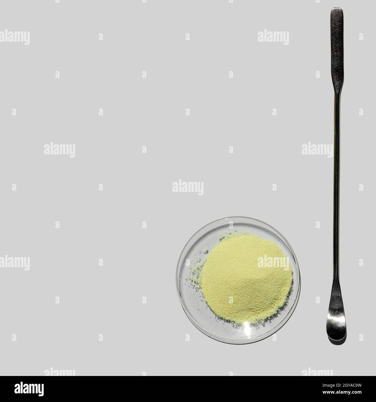 Optiblanc powder in chemical watch glass placed next to the stirring ...