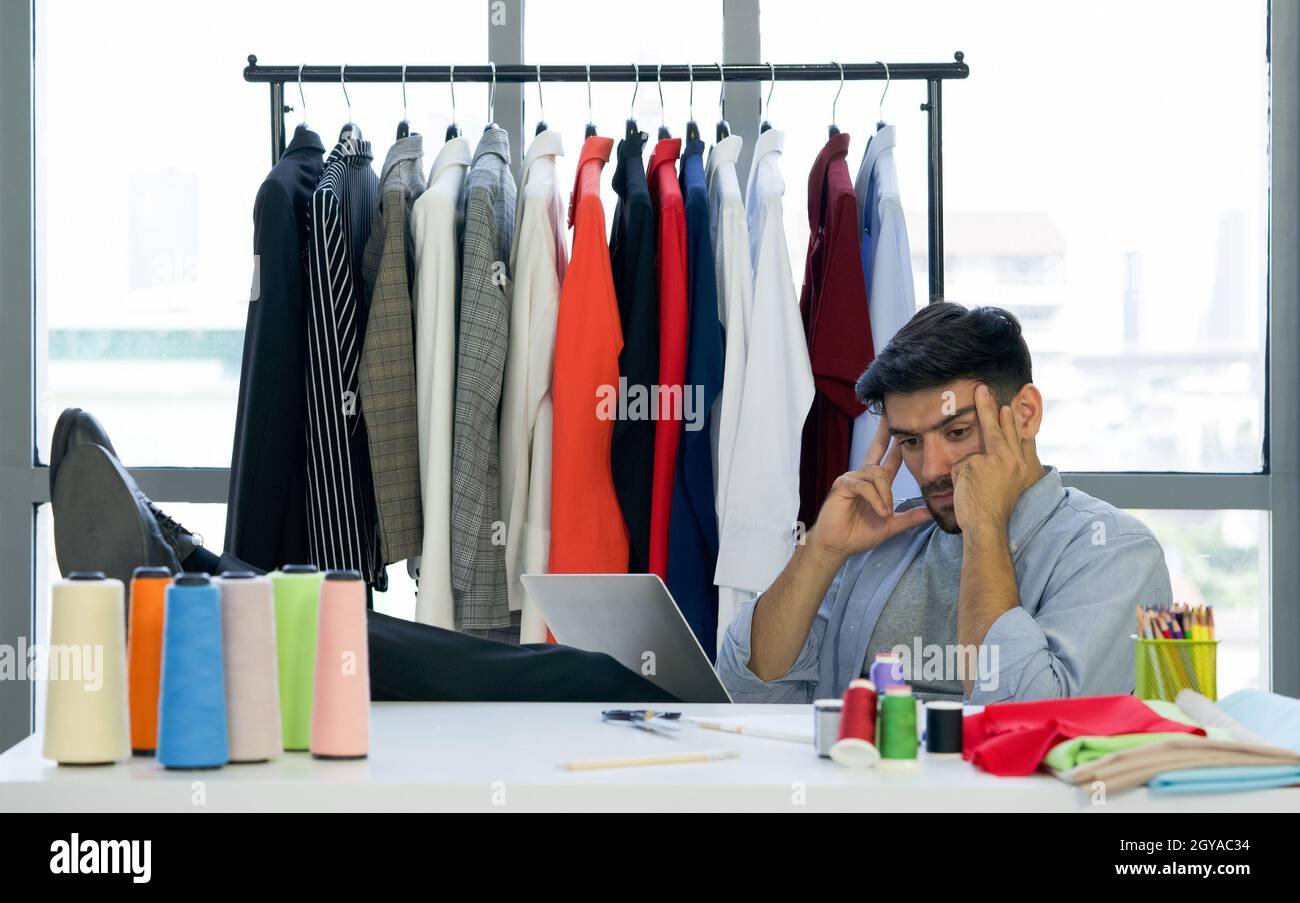 Fashion designer room, the tailor designs a new collection of clothes ...