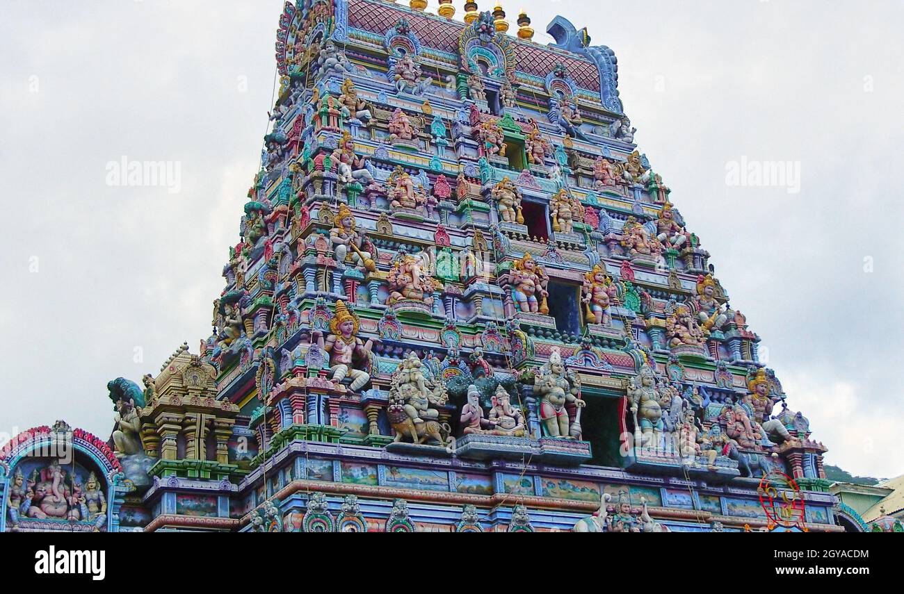 The roof of a Hindu temple with many detailed figures and ornaments ...