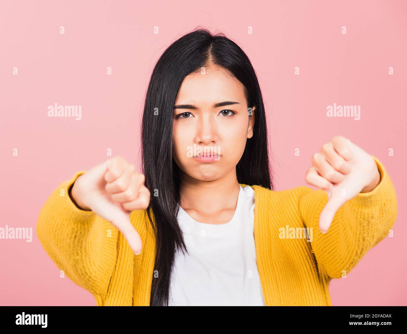 Portrait Asian beautiful young woman unhappy, negative gesture showing ...