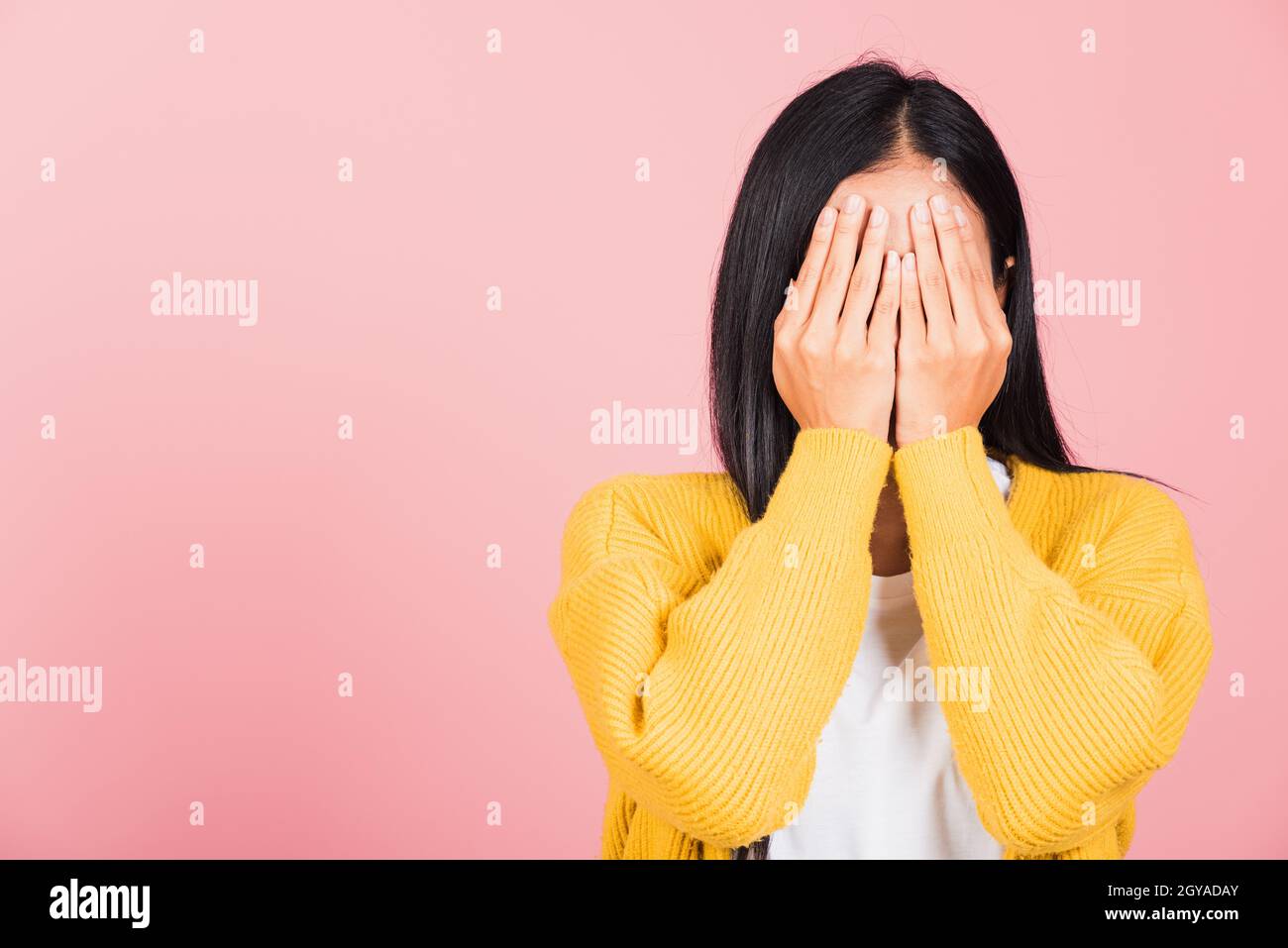 Woman embarrassed face in hands hi-res stock photography and images - Alamy