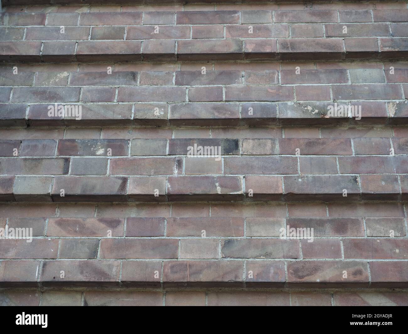 dark red brick wall useful as a background Stock Photo - Alamy