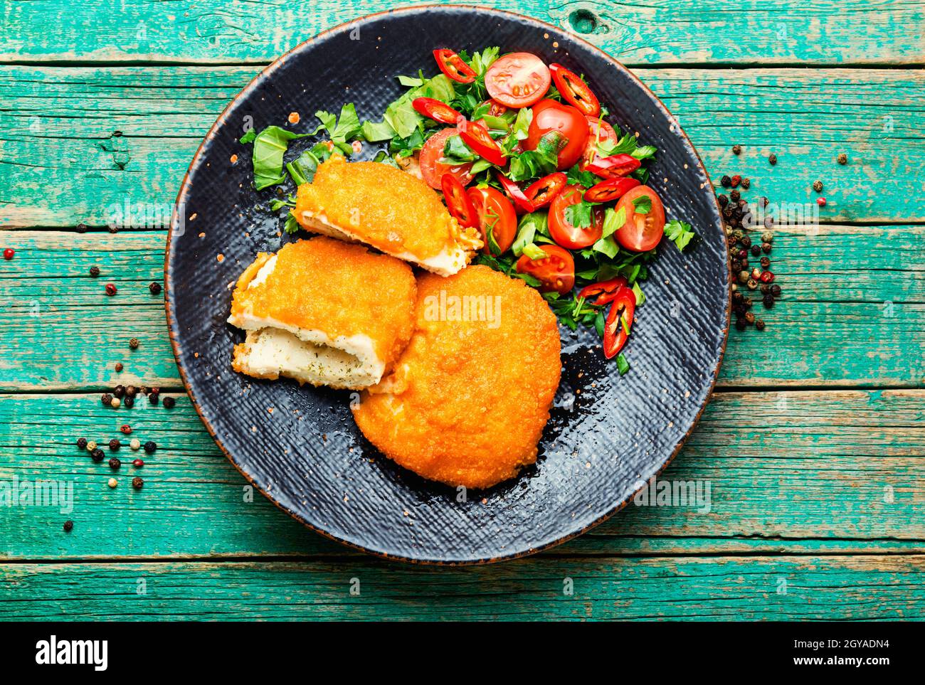 Chicken Kiev cutlet with fresh vegetable salad.Ukrainian food Stock ...
