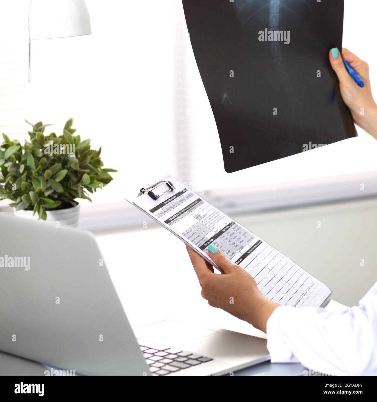 Professional doctor working in hospital office or clinic with other ...