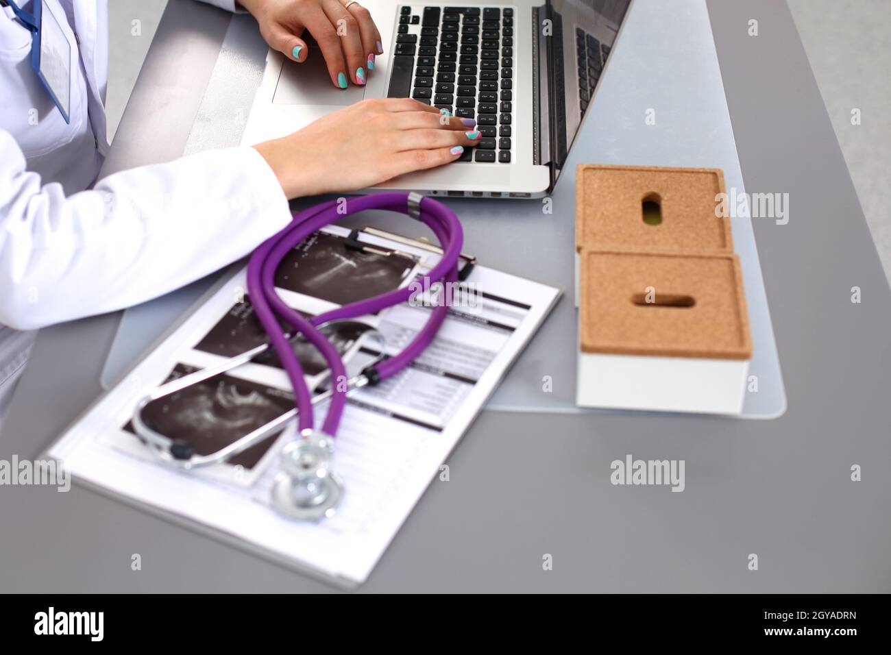 Professional doctor working in hospital office or clinic with other ...