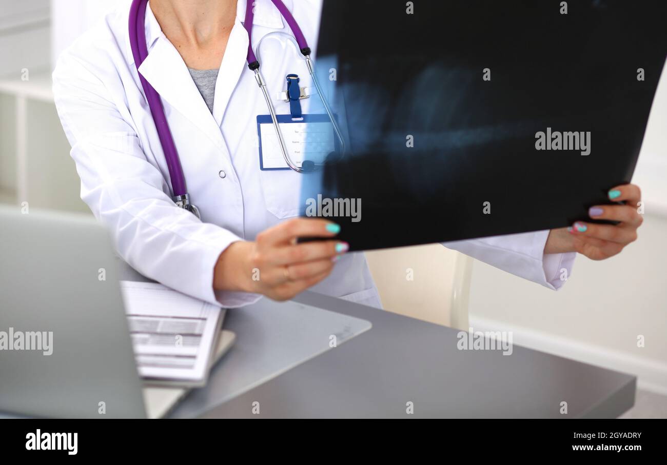Professional doctor working in hospital office or clinic with other ...
