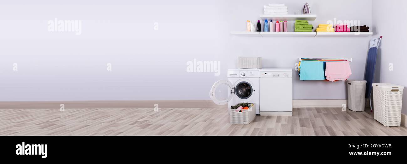 Utility Laundry Room Wall With Washing Machine Stock Photo - Alamy