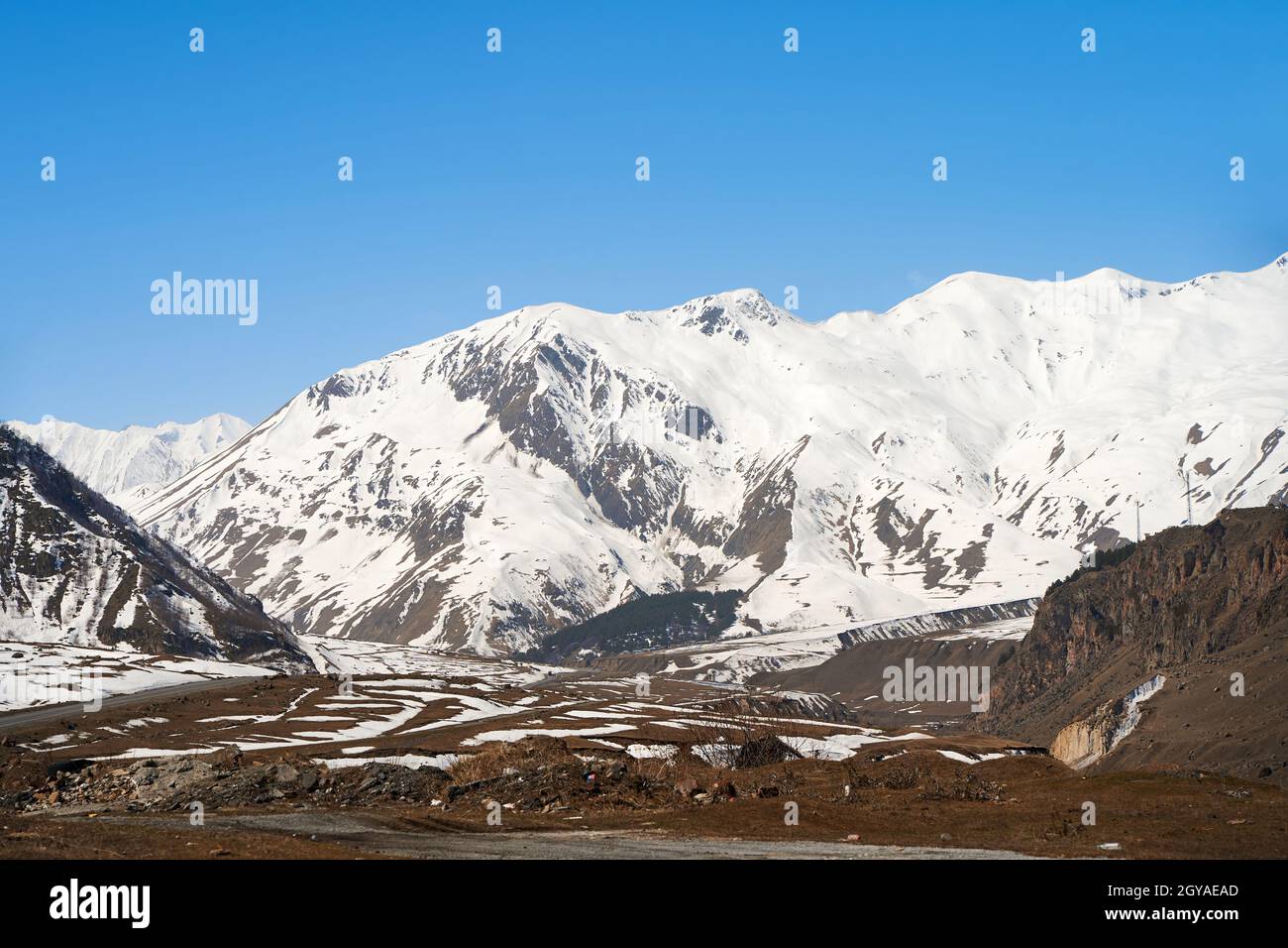 Mountain natural landscape. Snow caps of the mountain tops. Rocky rocks ...
