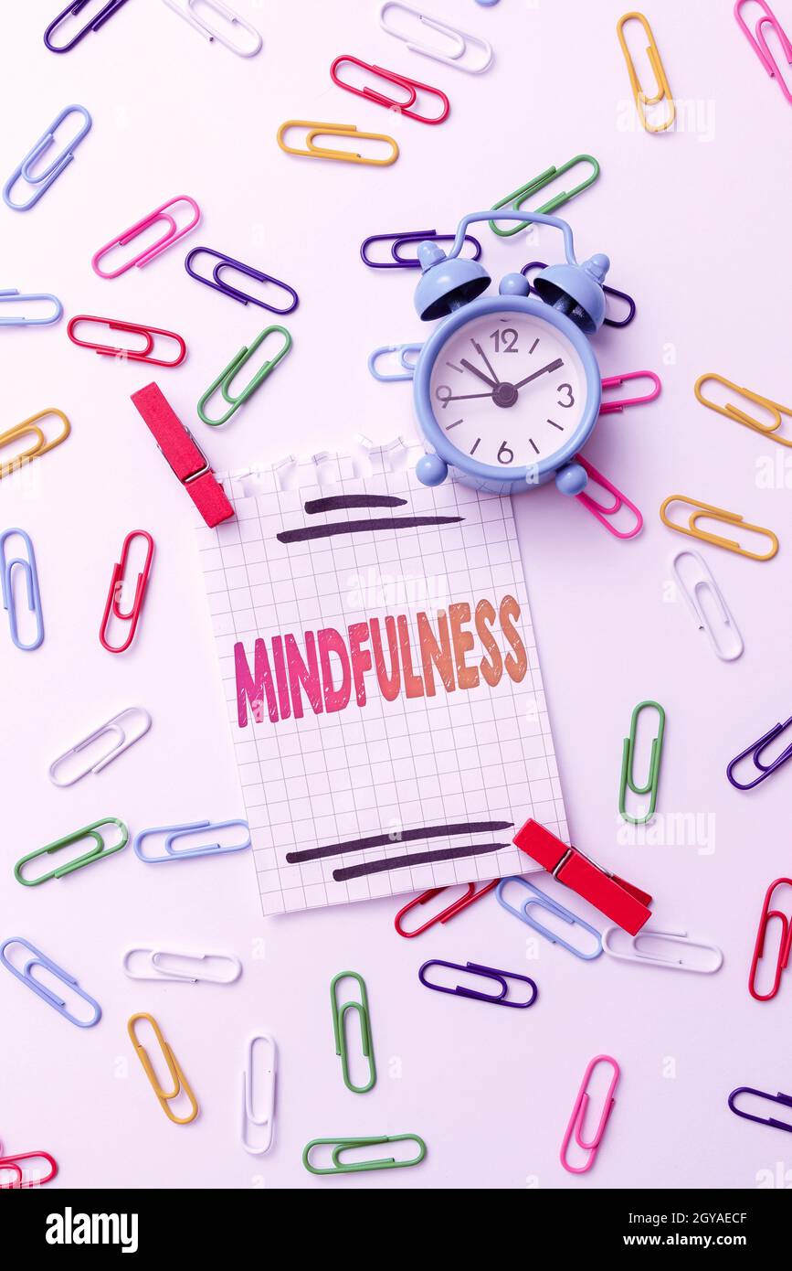 Hand writing sign Mindfulness, Business idea state of mind attained by ...