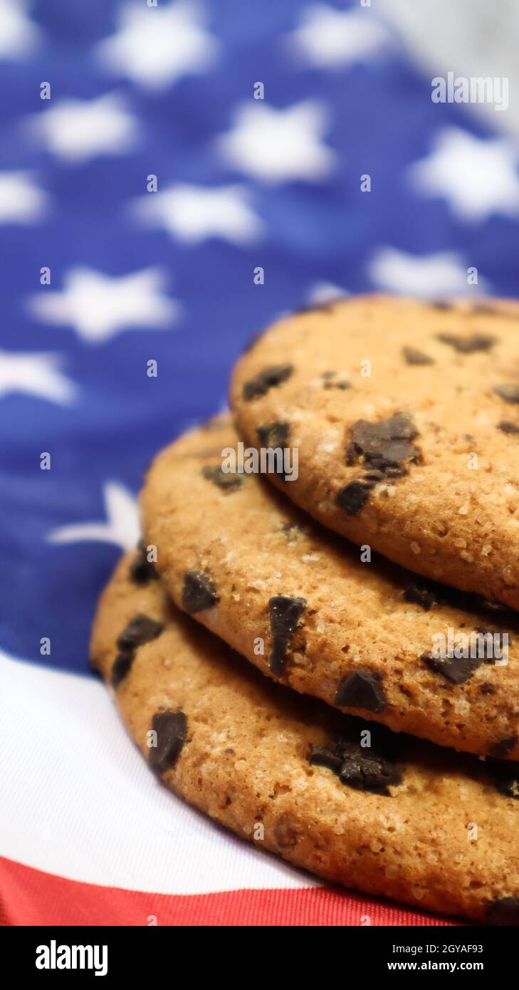 Patriotic cookies. Three rounded traditional chocolate chip cookies on ...
