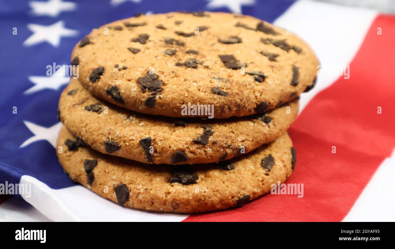 Patriotic cookies. Three rounded traditional chocolate chip cookies on ...
