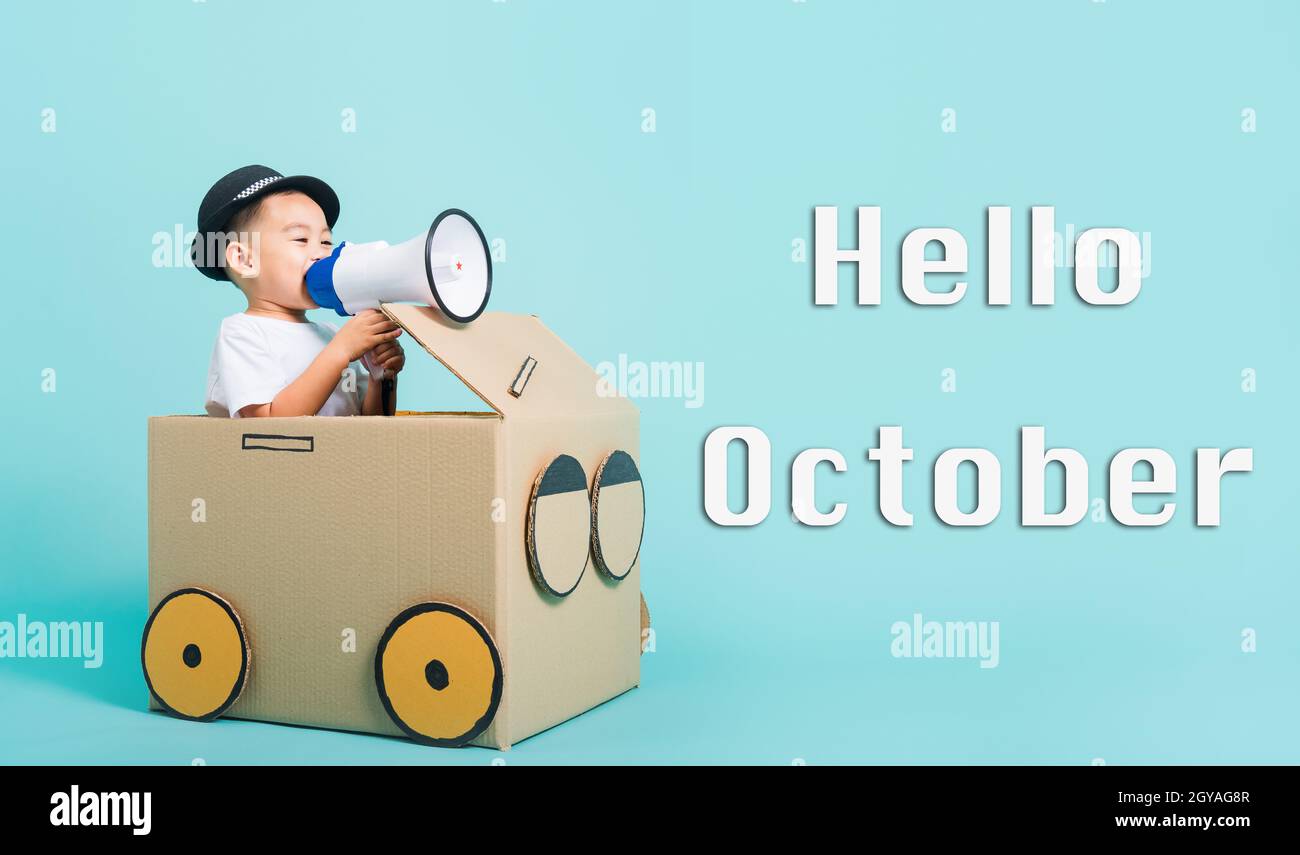 Hello October, Happy Asian children boy smile in driving play car ...