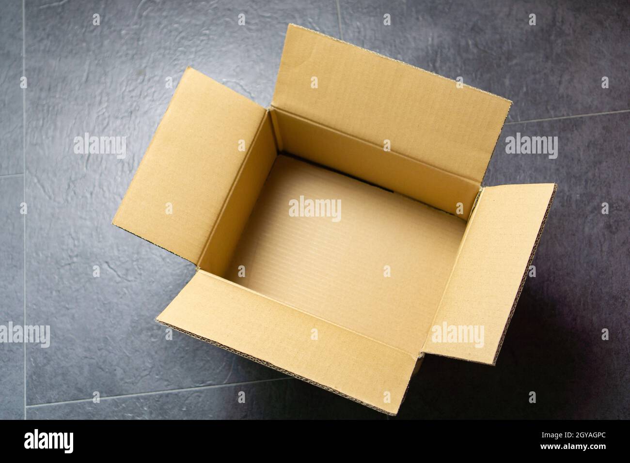 Opened cardboard box, view from above Stock Photo - Alamy