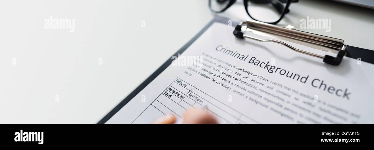Hand Filling Criminal Background Check Application Form Stock Photo - Alamy