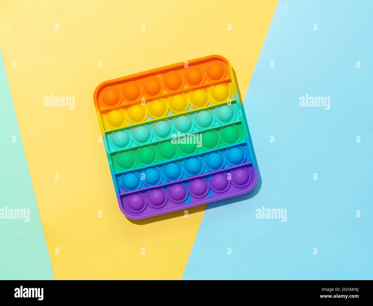 Popit on multicolor background with copy space. Popular silicone ...