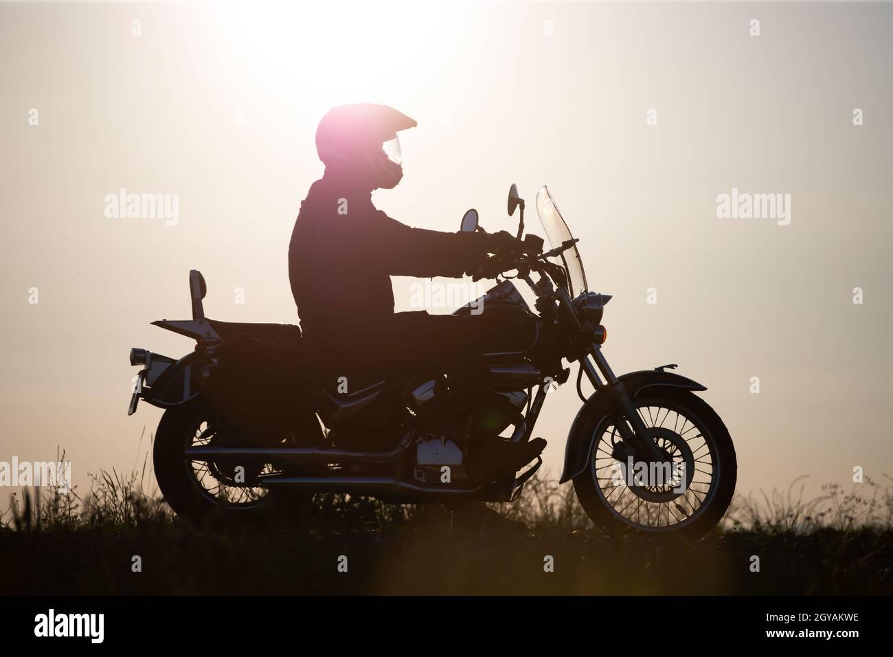 Motorcycle driver riding on countryside. Travel and sport, speed and ...