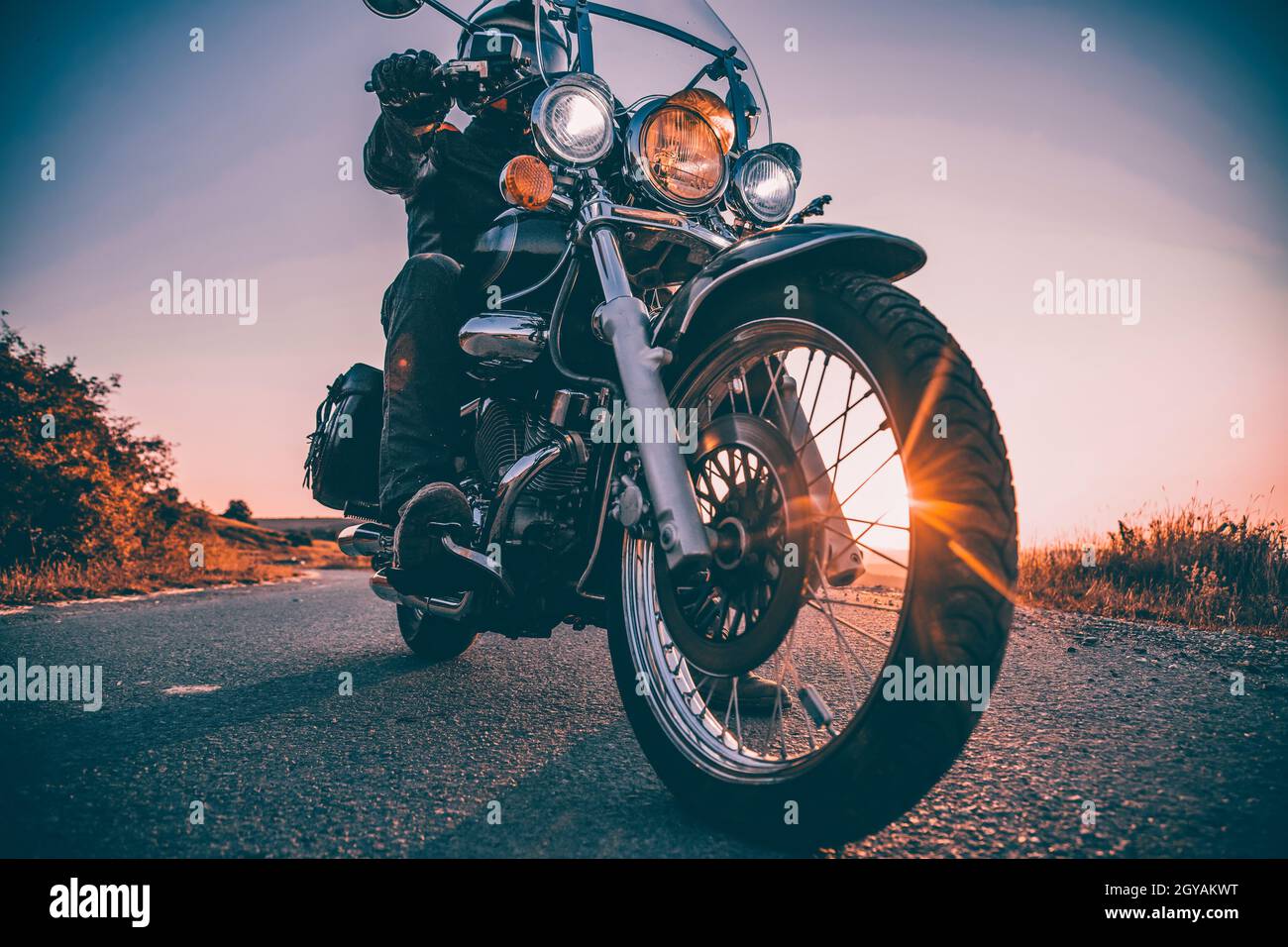 Motorcycle driver riding on countryside. Travel and sport, speed and ...