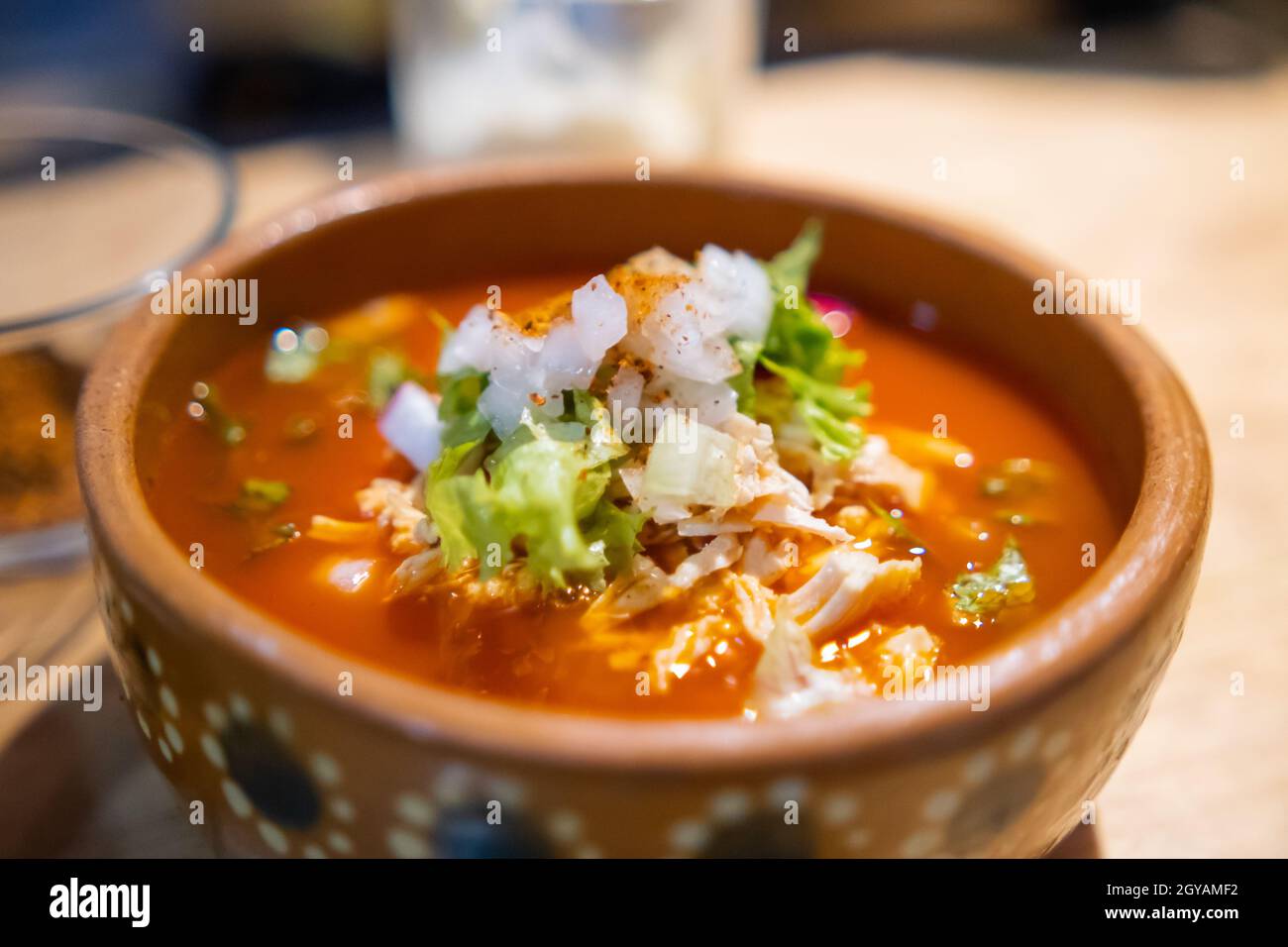 Clay bowl of delicious and traditional Mexican pozole Stock Photo - Alamy