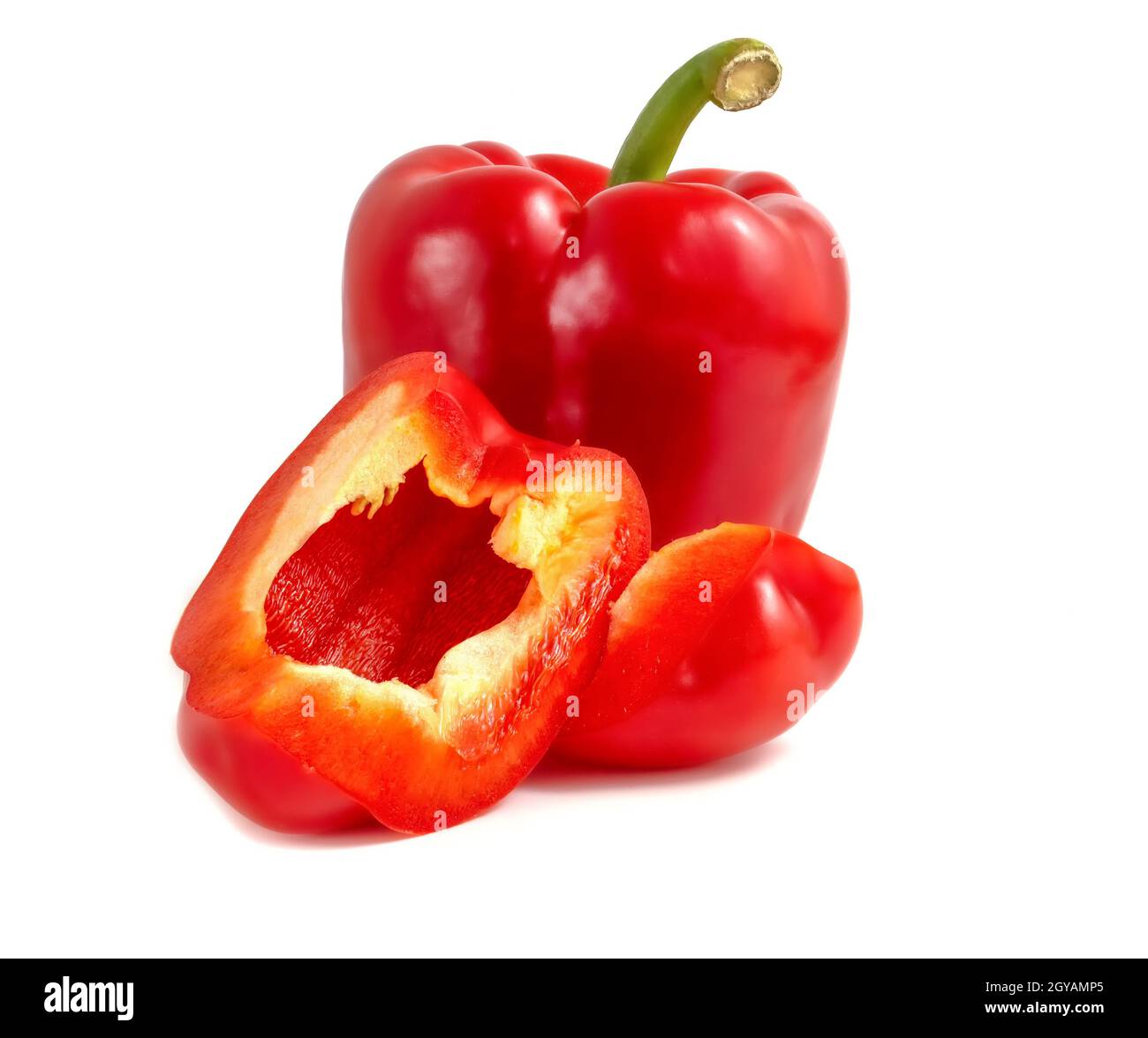 Red bell pepper. Whole vegetable and cut in half isolated on white ...