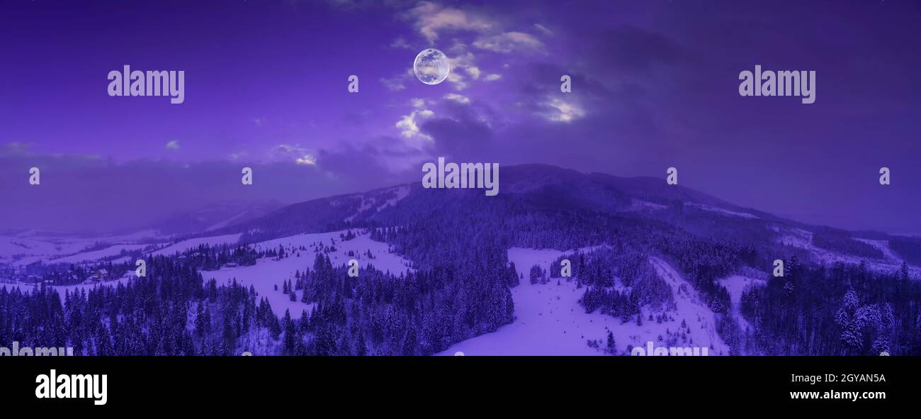 Panorama of dark night forest and mountains. Winter night, clouds and ...