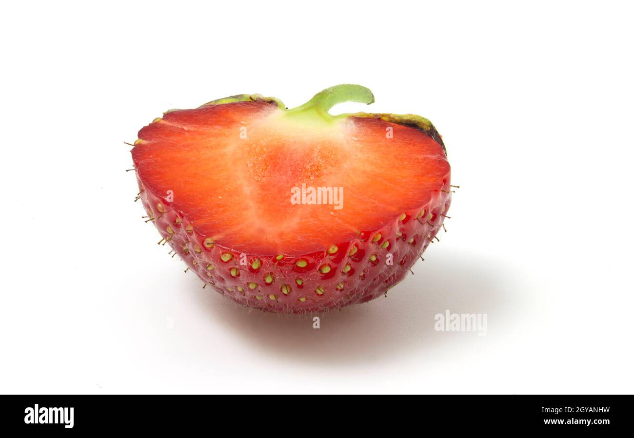 Red strawberry in cut isolated on white background. Full focus of half ...