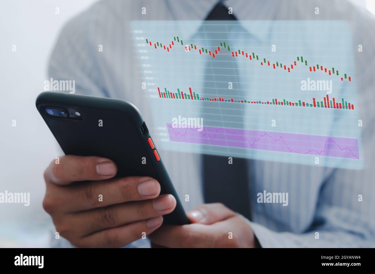 businessman using mobile phone to analyze stock market and economic ...