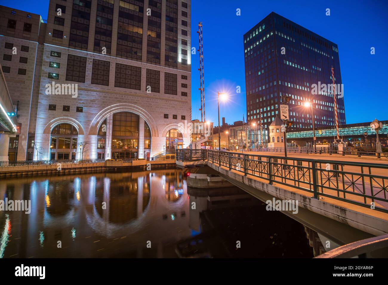 Downtown skyline with Buildings along the Milwaukee River at night, in ...