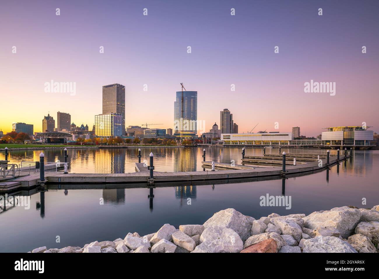 Milwaukee skyline at twilight with city reflection in lake Michigan and ...