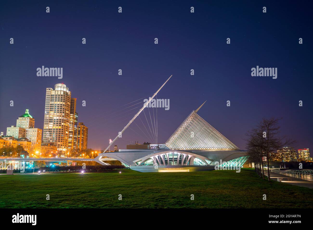 Milwaukee skyline at twilight with city reflection in lake Michigan and ...