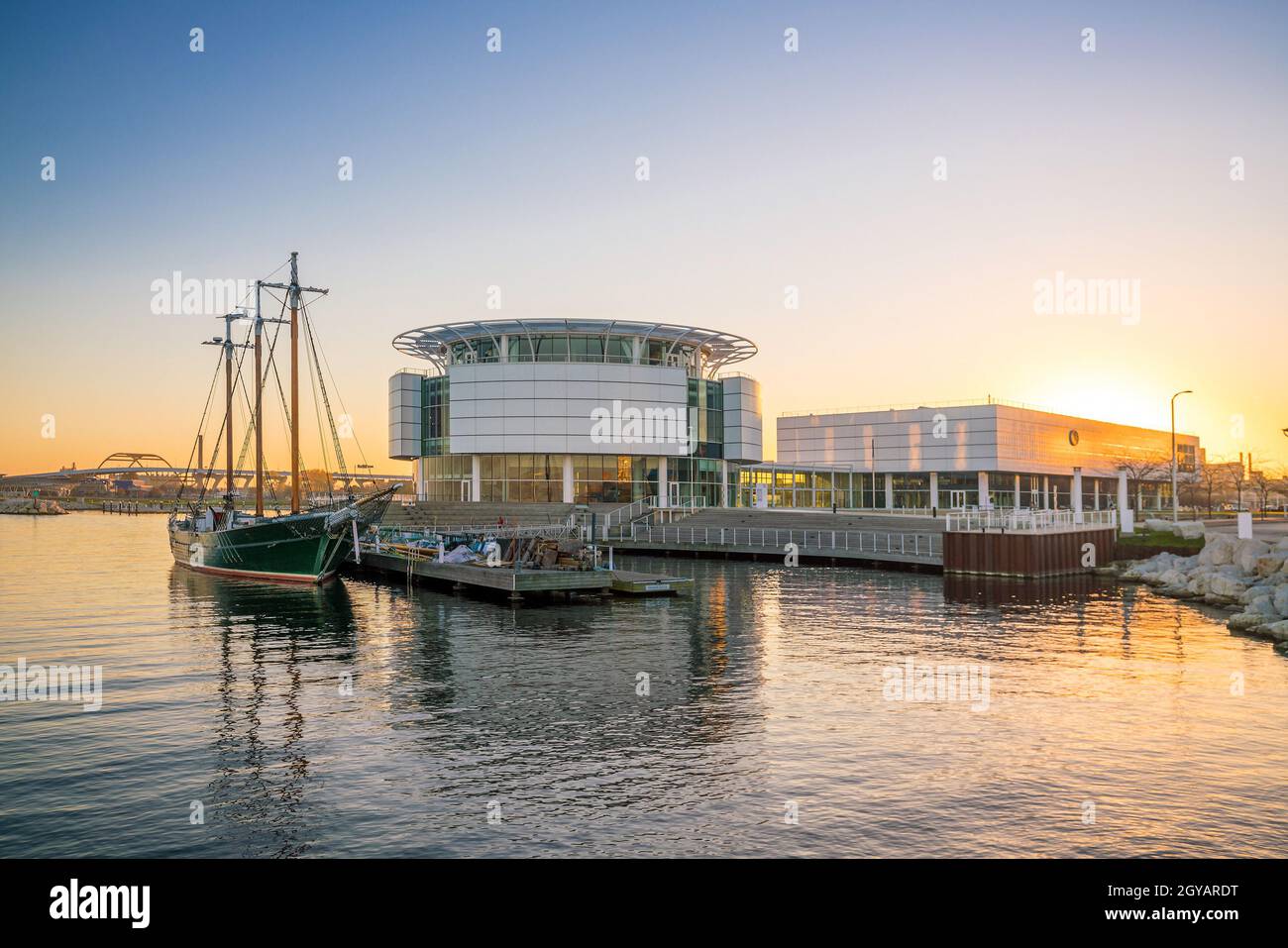 Milwaukee skyline at twilight with city reflection in lake Michigan and ...