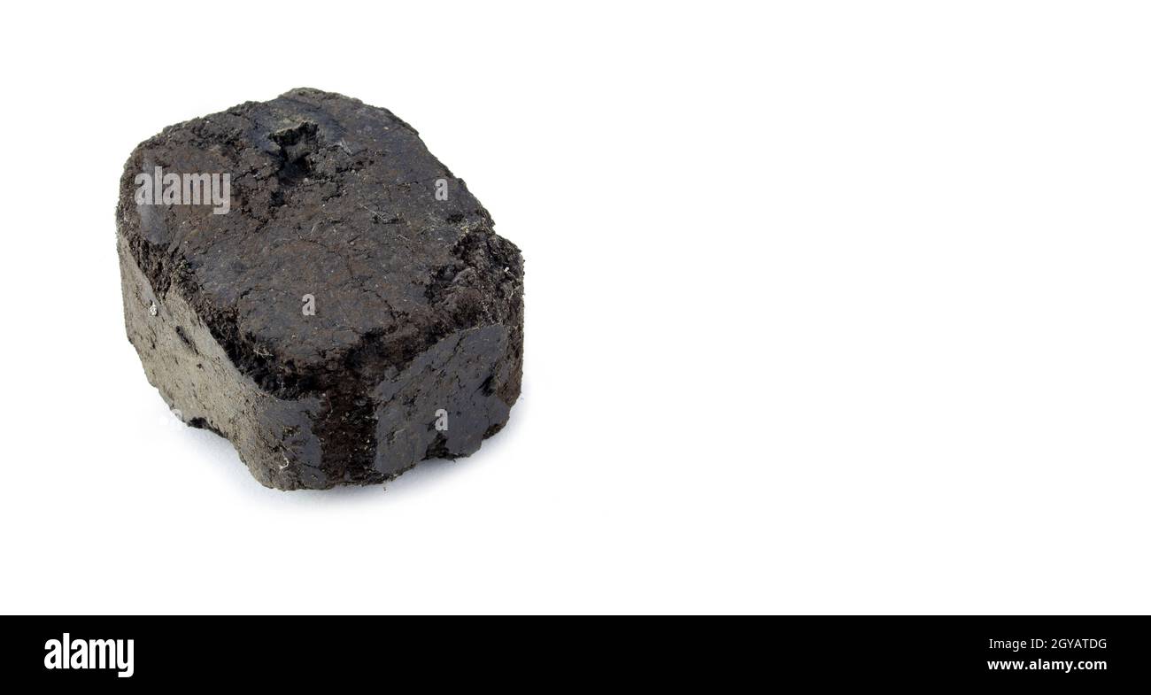 Coal fuel briquette isolated on white background Stock Photo - Alamy