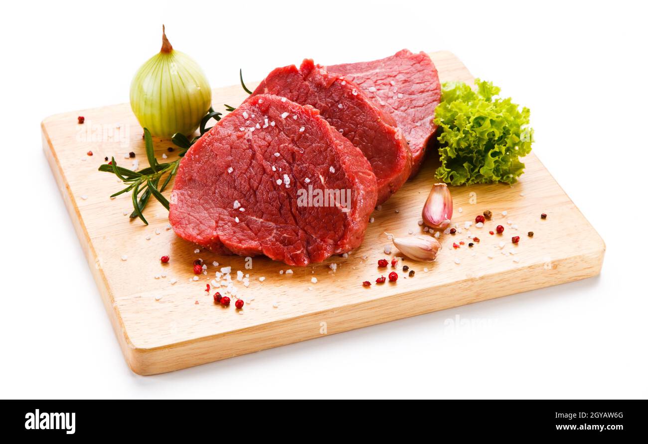 Raw pork chops on cutting board and vegetable Stock Photo - Alamy
