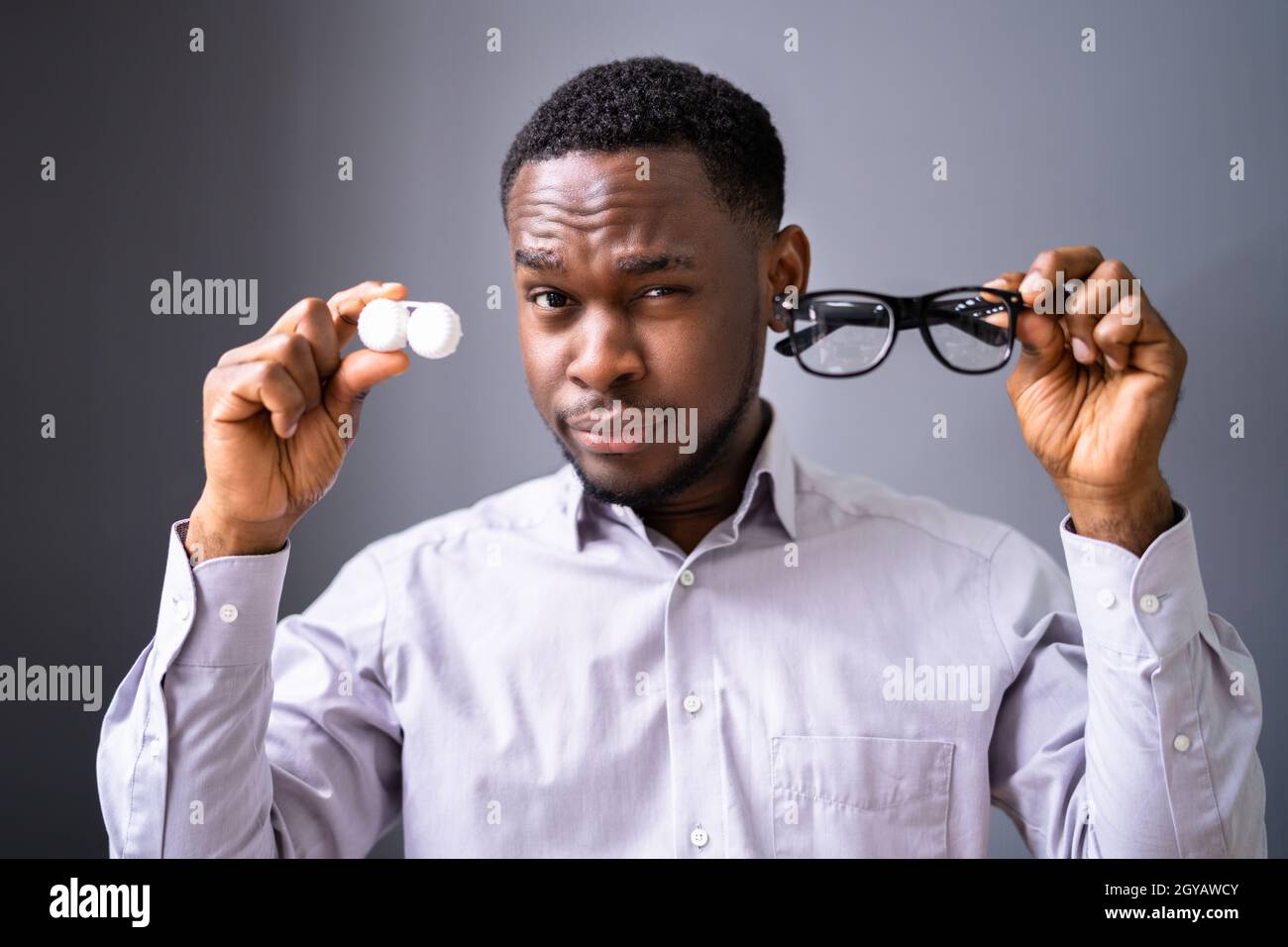 Optometrist choosing eye test lenses hi-res stock photography and ...