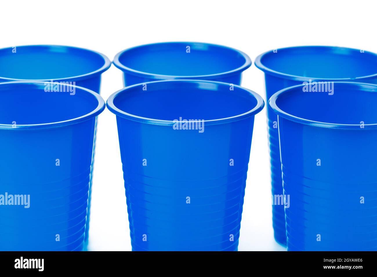 Pile of plastic cups on white background Stock Photo - Alamy