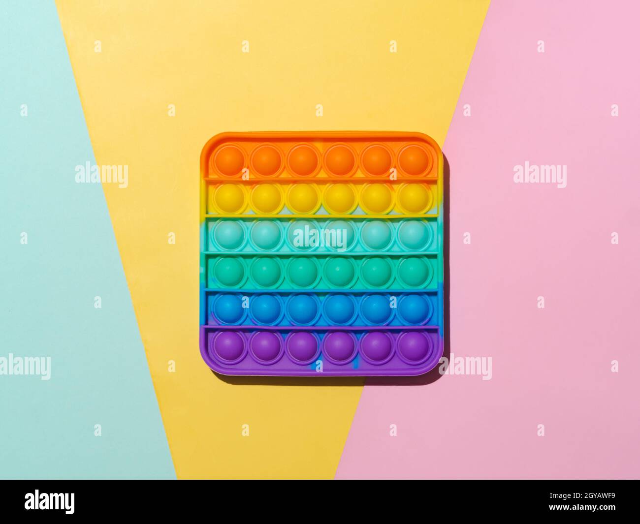 Popit on multicolor background with copy space. Popular silicone ...